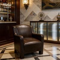 China Designer Genuine Leather Union Jack Patchwork Armchair Luxury Vintage Accent Chair with British Flag Pattern for Club Bar Hall for sale