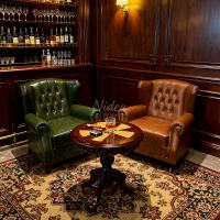 China Old Money Aesthetic Forest Green Genuine Leather Wingback Chair Luxury Tufted Chesterfield for Living Room & Club for sale