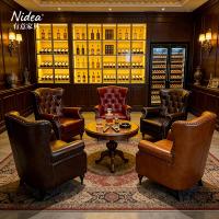 China Handcrafted Genuine Leather Wing Chair Brass Casters Vintage Deep Tufted Antique British Design Living Room Club Chair for Bar for sale