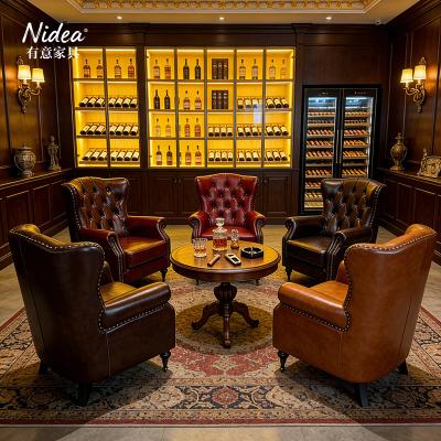 China Handcrafted Genuine Leather Wing Chair Brass Casters Vintage Deep Tufted Antique British Design Living Room Club Chair for Bar for sale