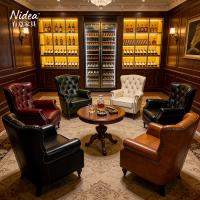 China Handcrafted Genuine Leather Wing Chair Brass Casters Vintage Deep Tufted Antique British Design Living Room Club Chair for Bar for sale