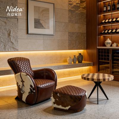 China Nidea Luxury Equestrian Style Genuine Leather Saddle Lounge Chair Ottoman-Handmade Ergonomic Living Room Furniture for Home Club for sale