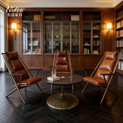 China Modern Minimalist Gold Metal Windsor Lounge Chair Industrial Luxury Segmented Leather High Back Armchair Living Room & Hotel Use for sale