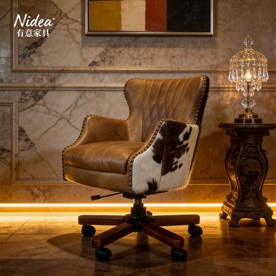 China Luxury Western Cowhide Leather Executive Office Chair Swivel Desk Chair with Solid Wood Base & Nailhead Trim for sale