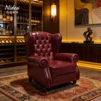 China Luxury Vintage Wine Red Leather Chesterfield Wingback Armchair Tufted Design Ergonomic Durable Build Brass Casters Club Bar for sale