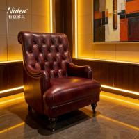 China Luxury Wine Red Leather Chesterfield High Back Armchair with Ottoman Set Classic Tufted Scrolled Back Reading Chair for Club for sale