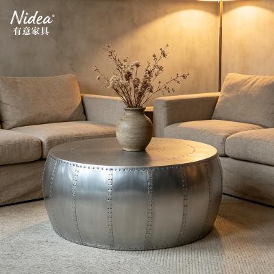 China Industrial Aviator Aluminum Coffee Table Round Riveted Metal Drum Center Table Modern Luxury Statement Piece for Living Room for sale