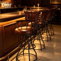 China Vintage Leather Swivel Bar Stool Industrial Metal Frame Counter Chair with Button-Tufted Back Retro Kitchen Island Stool for sale