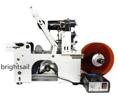 China XT-50 Semi Automatic Round Bottle Labeling Machine 10-40 Pcs/Min ±0.5mm Accuracy 76mm Label Diameter for sale