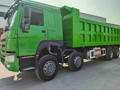 China Used Sinotruk HOWO 8x4 Dump Truck 351-420hp Green Color Front Lifting 8.2m Cargo Tank for sale