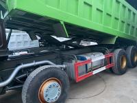 China Used HOWO 8x4 Dump Truck 375-430hp Left Hand Drive Green Euro II-V for sale