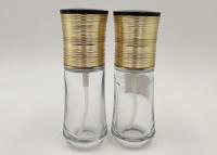 China 30ml Transparent Glass Cosmetic Bottle with Lotion Pump Macrame Golden Design for sale