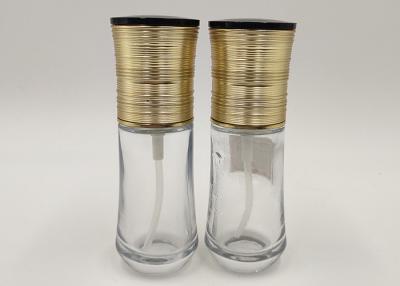 China 30ml Transparent Glass Cosmetic Bottle with Lotion Pump Macrame Golden Design for sale