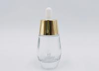 China 1oz 30ml Clear Glass Dropper Bottle with Golden or Silver Cap for Skincare Packaging for sale