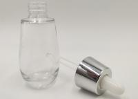 China 1oz 30ml Clear Glass Dropper Bottle with Golden or Silver Cap for Skincare Packaging for sale