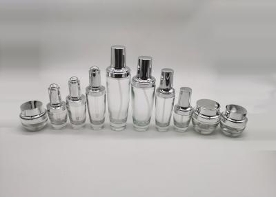 China 20ml 50ml Transparent Emulsion Spray Glass Bottle with Silver Pressure Pump for sale