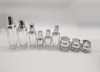 China 20ml 50ml Transparent Emulsion Spray Glass Bottle with Silver Pressure Pump for sale