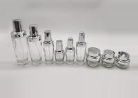 China 20ml 50ml Transparent Emulsion Spray Glass Bottle with Silver Pressure Pump for sale