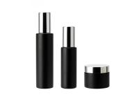 China Round Matte Frosted 50ml Black Glass Cosmetic Bottles with Sprayer for sale
