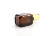 China 30ml Amber Square Glass Cosmetic Bottles for Essential Oil Serum with Pump for sale
