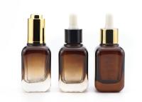 China 30ml Amber Square Glass Cosmetic Bottles for Essential Oil Serum with Pump for sale
