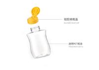 China 18oz 350ml Plastic Cosmetic Bottle with Silicone Valve Cap for Honey Syrup Packing for sale