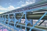 China Enclosed Pipe Belt Conveyor Dust-Free Bulk Material Transport for Mining, Cement & Power Plants for sale