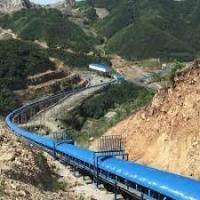 China Heavy-Duty Long-Distance Conveyor with Curved Routing for Mining and Cement Plants for sale