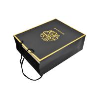 China Durable Black Custom Paper Shopping Bags With Golf Foil Logo for sale