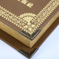 China Embossing Wooden Book Shaped Gift Box Leather Wrapping Surface Round Spine 3D Metal Logo for sale