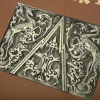 China Embossing Wooden Book Shaped Gift Box Leather Wrapping Surface Round Spine 3D Metal Logo for sale