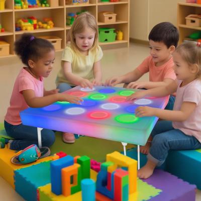 China RGB touch activated light table for kids and parties, square table with 16 glowing touch sensors, foldable legs, USB rechargeable, multicolor LED effects for sale