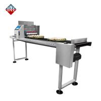 China Six Nozzle Automatic Egg Spray Coding Machine Printing for sale