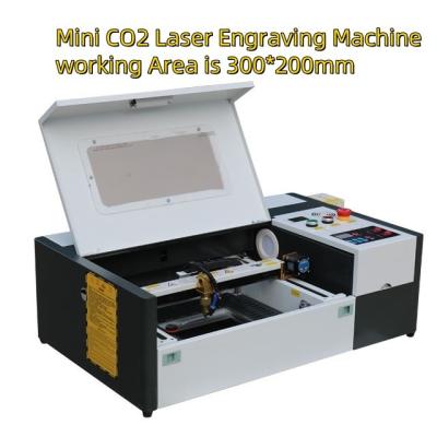 China 40W 50W 300*200 3020 Small Portable Laser Engraver CO2 Laser Printer for sale