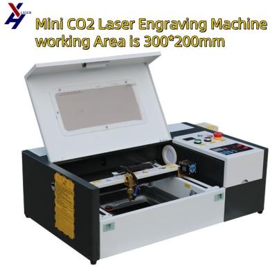 China 3020 Small Laser Engraver 40W 50W Laser Rubber Stamp Machine Laser Carving Machine for sale