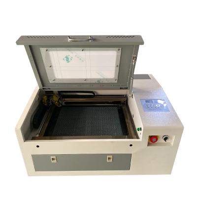 China 3020 4040 Small CO2 Laser Engraver 40W 50W For Rubber Stamp Acrylic for sale