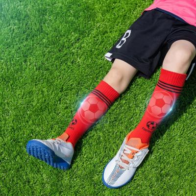 China Stirrup Shin Pad Sleeve Reflective Youth Football Socks Anti-Slip Grip Knee High Kids Soccer Training Socks for sale