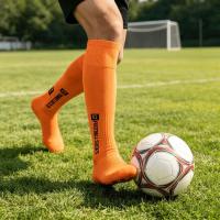 China Anti-Blister Arch Support Graduated Compression Football Socks Cushioned Athletic Knee High Soccer Grip Socks for sale