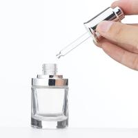 China 30ml Round Shoulder Cosmetic Glass Press Essential Oil Essence Dropper Bottle for sale