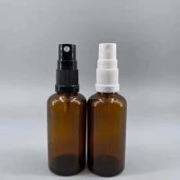 China 1 oz fine mist glass spray bottle 2 oz amber glass boston round bottles black treatment pump for sale