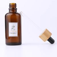 China 0.34oz 10ml Amber Glass Essential Oil Dropper Bottle With Eye Dropper Bamboo Cosmetic Bottles for sale