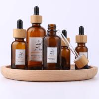 China 0.34oz 10ml Amber Glass Essential Oil Dropper Bottle With Eye Dropper Bamboo Cosmetic Bottles for sale