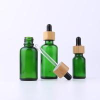 China 100ml 50ml 30  Ml 15ml Green Essential Oil Glass Dropper Bottles Eye Dropper Bamboo Lid Cosmetic Jar for sale