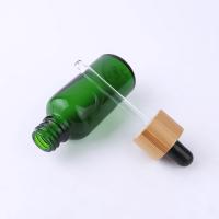 China 100ml 50ml 30  Ml 15ml Green Essential Oil Glass Dropper Bottles Eye Dropper Bamboo Lid Cosmetic Jar for sale