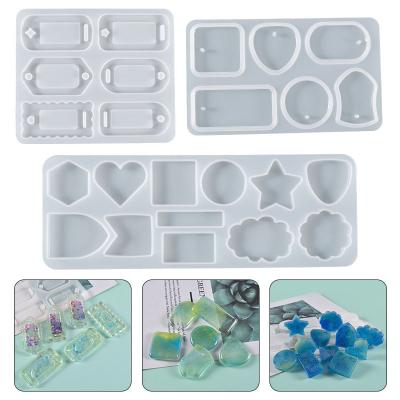 China DIY Crystal Drip Glue Aromatherapy Gypsum Grinding Tools with Perforated Flowing Sand Earrings Pendant Silicone Mold Wholesale for sale