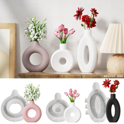 China Nordic Circle Vase Silicone Mold Elliptical Circle Stripes Ins Wind Pendant Sweet Donut Flower Vase Grinding for sale