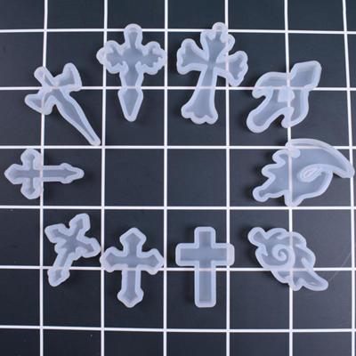 China Crystal Dropping Glue Cross Pendant Silicone Mold DIY Handmade Multiple Cross Star Model Pendants for sale