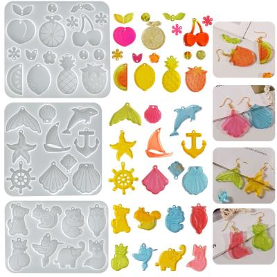 China DIY Crystal Dropping Gel Sea Star Shell Dolphin Fruit Animal Series Earrings Pendant Silicone Mold for sale