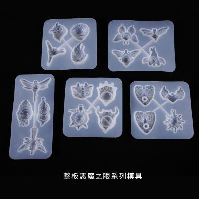 China Diy Crystal Glue Drop Mould Devil's Eye Owl Moth Cthulhu Goth Pendant Silicone Mould for sale