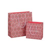 China PP Twist Handle Paper Packaging Bags 230gsm White Kraft Paper Material for sale